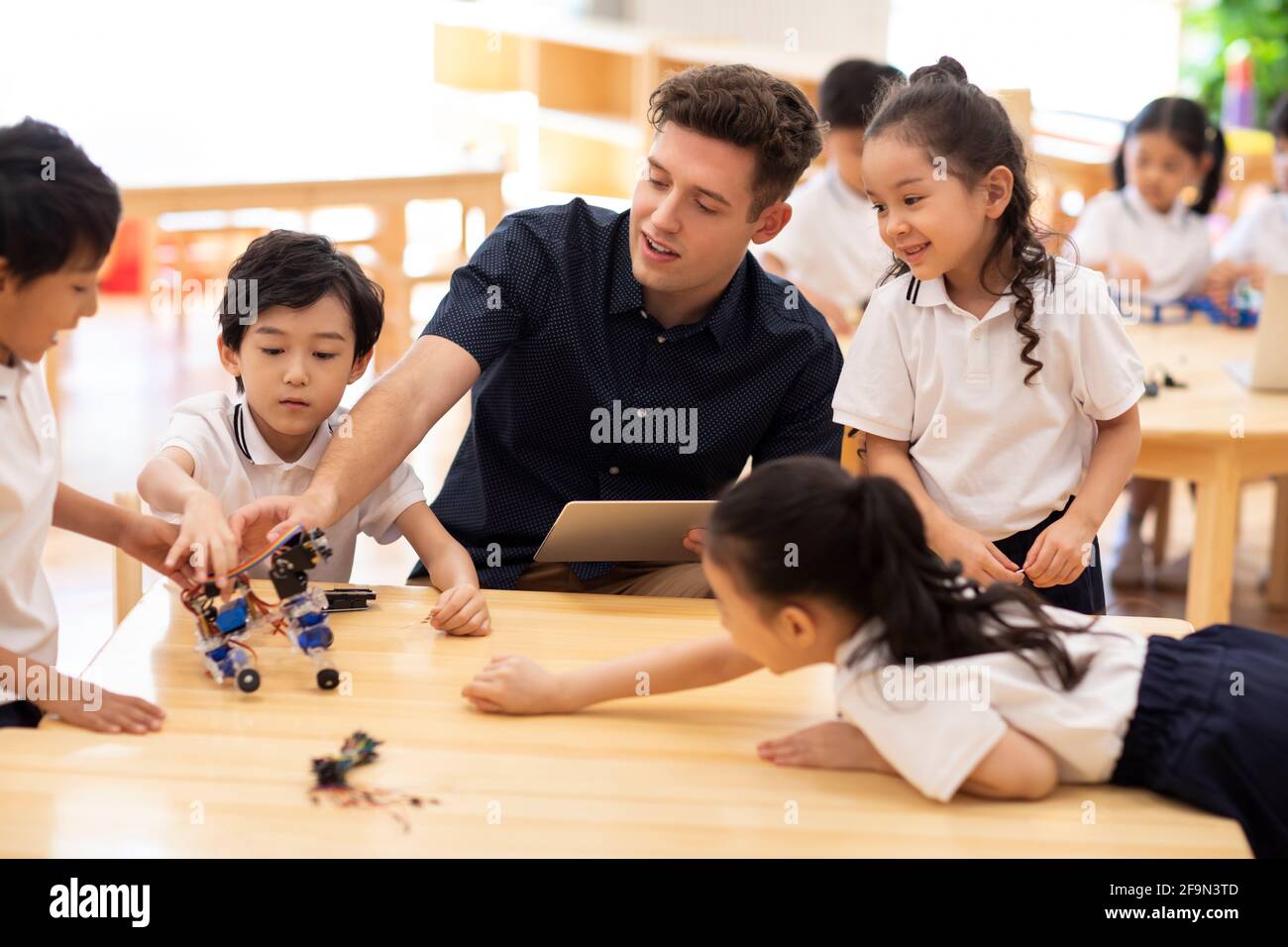 Children learning coding in classroom Stock Photo - Alamy