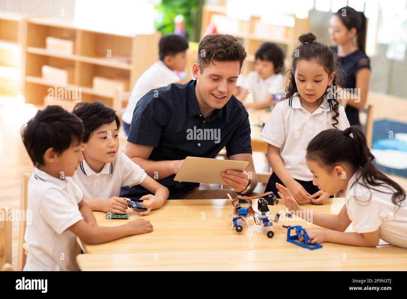 Children learning coding in classroom Stock Photo - Alamy