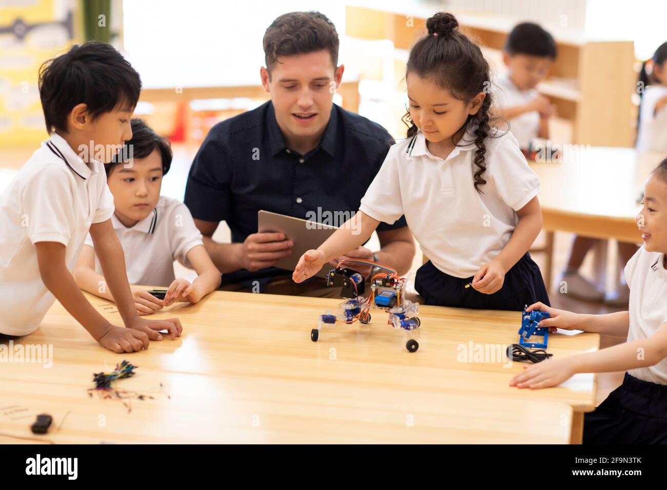 Children learning coding in classroom Stock Photo - Alamy