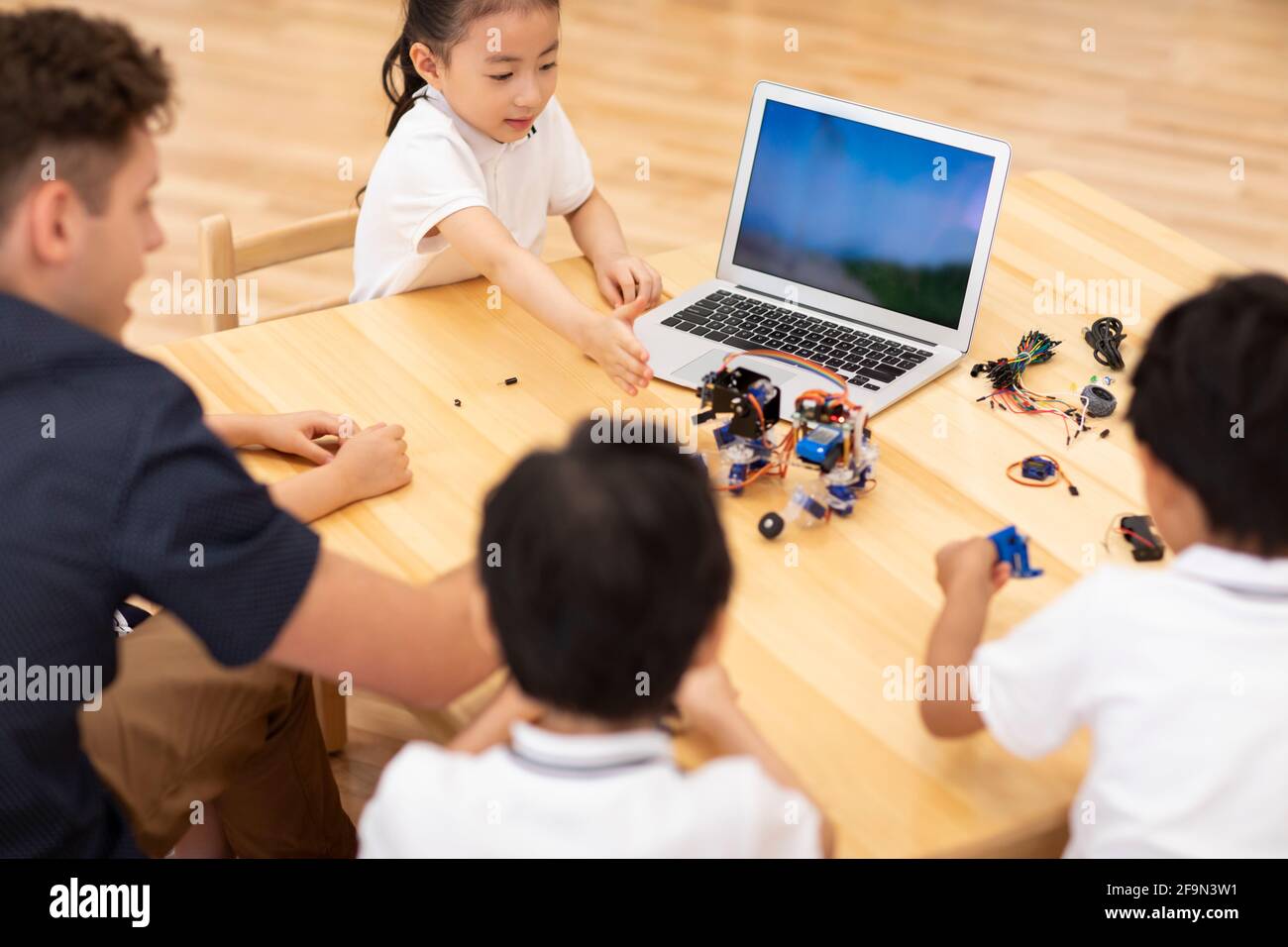 Children learning coding in classroom Stock Photo - Alamy