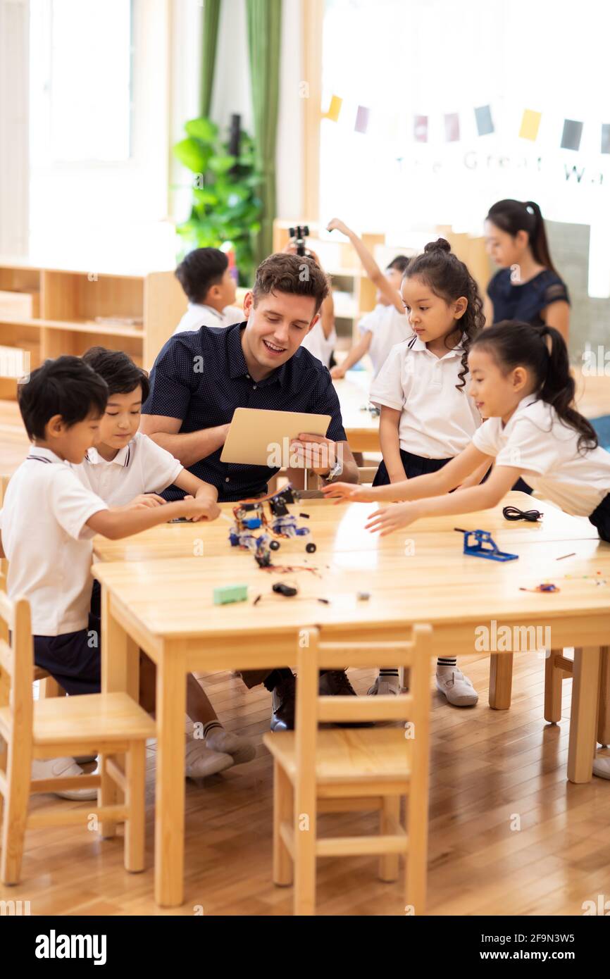 Children learning coding in classroom Stock Photo - Alamy