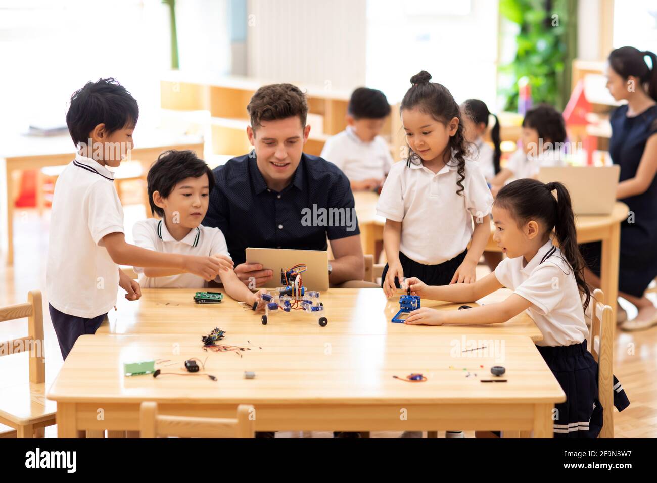 Children learning coding in classroom Stock Photo - Alamy