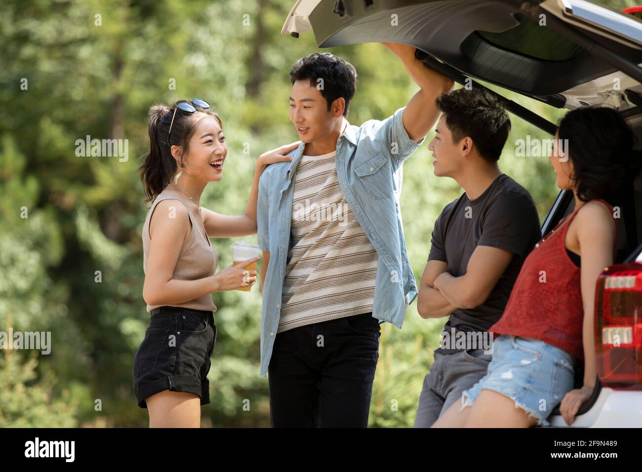 Three friends laughing in car hi-res stock photography and images - Alamy