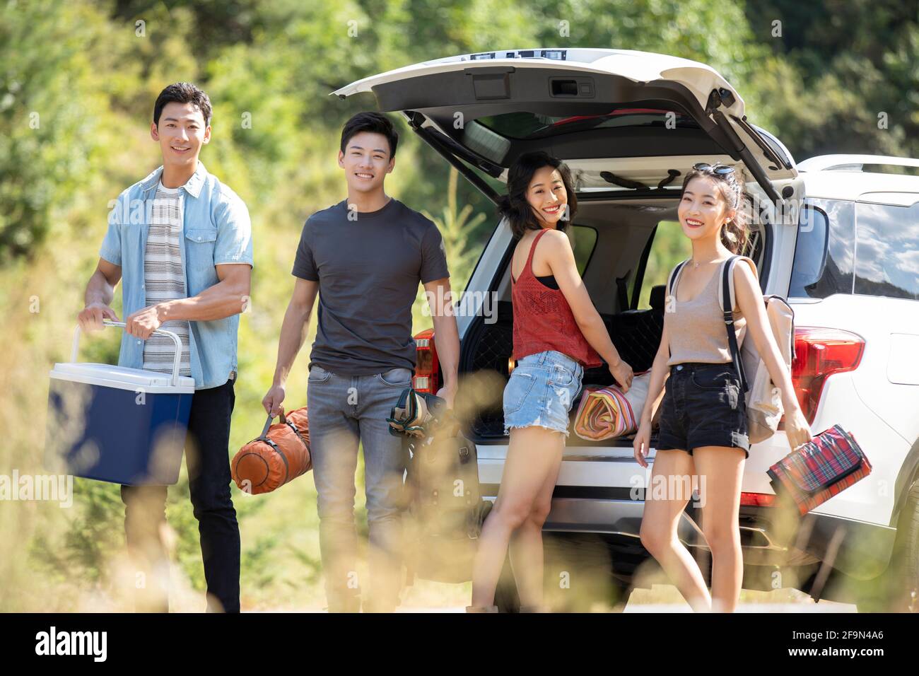 Group young asian friends camping hi-res stock photography and images - Alamy