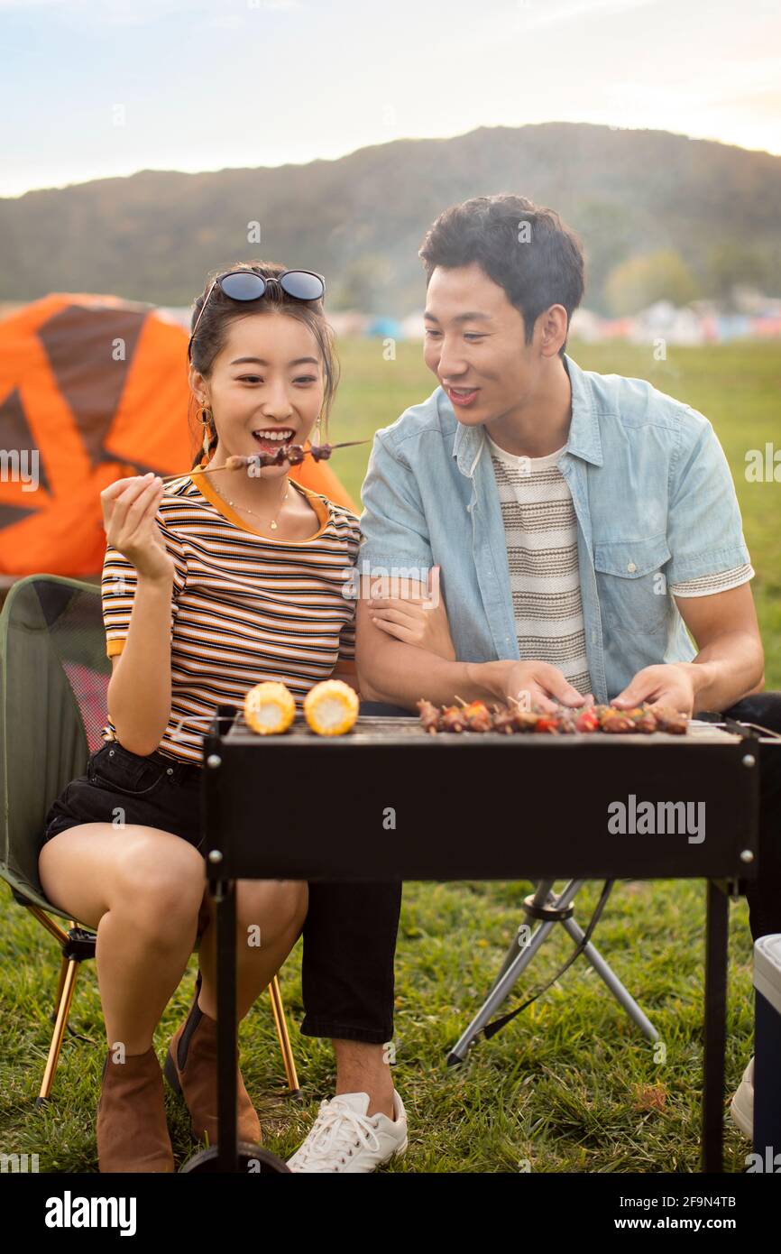 Young people barbecuing hi-res stock photography and images - Alamy