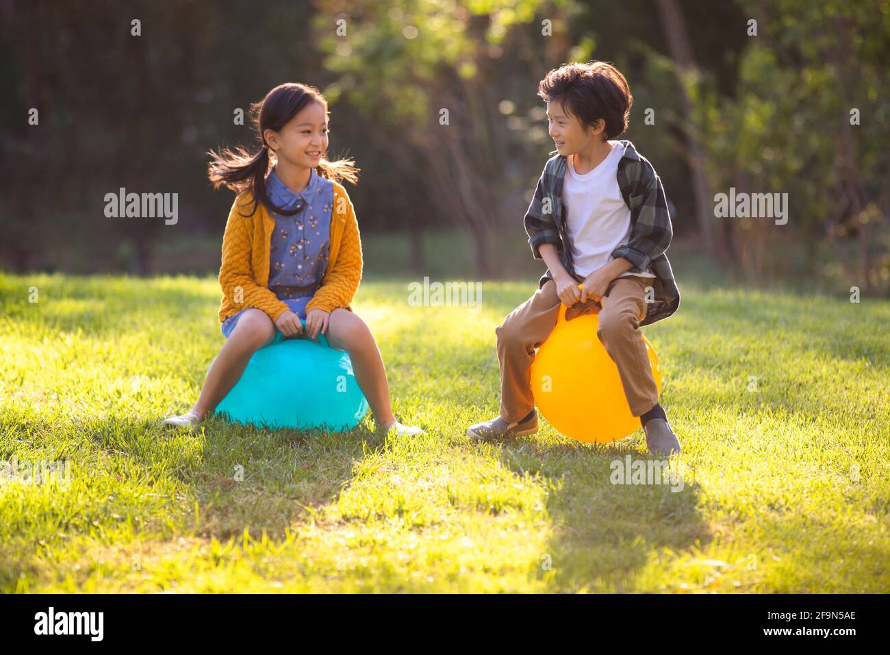 Child bouncing ball hi-res stock photography and images - Alamy