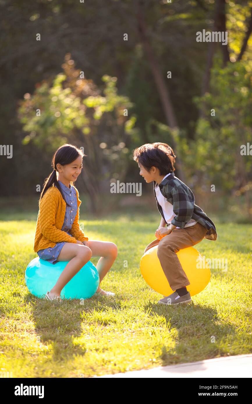 Child bouncing ball hi-res stock photography and images - Alamy