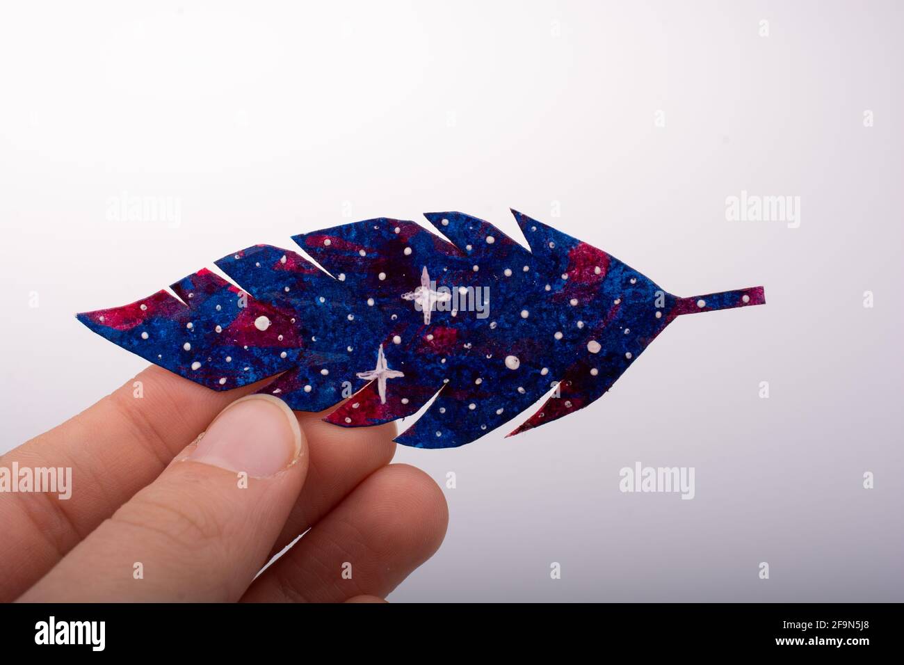 Hand made paper cut leaf icon on white background Stock Photo - Alamy