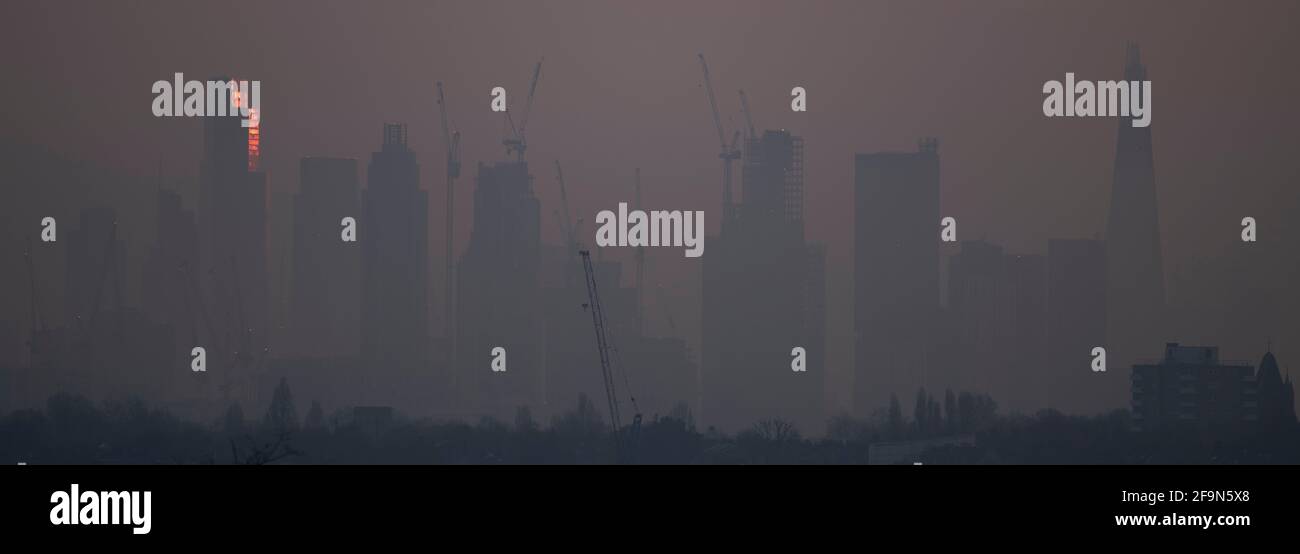 London, UK. 20 April 2021. Thin low lying mist in the suburbs obscures ...