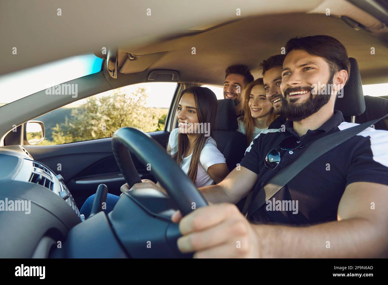 Group of young happy people having fun together and enjoying road trip ...