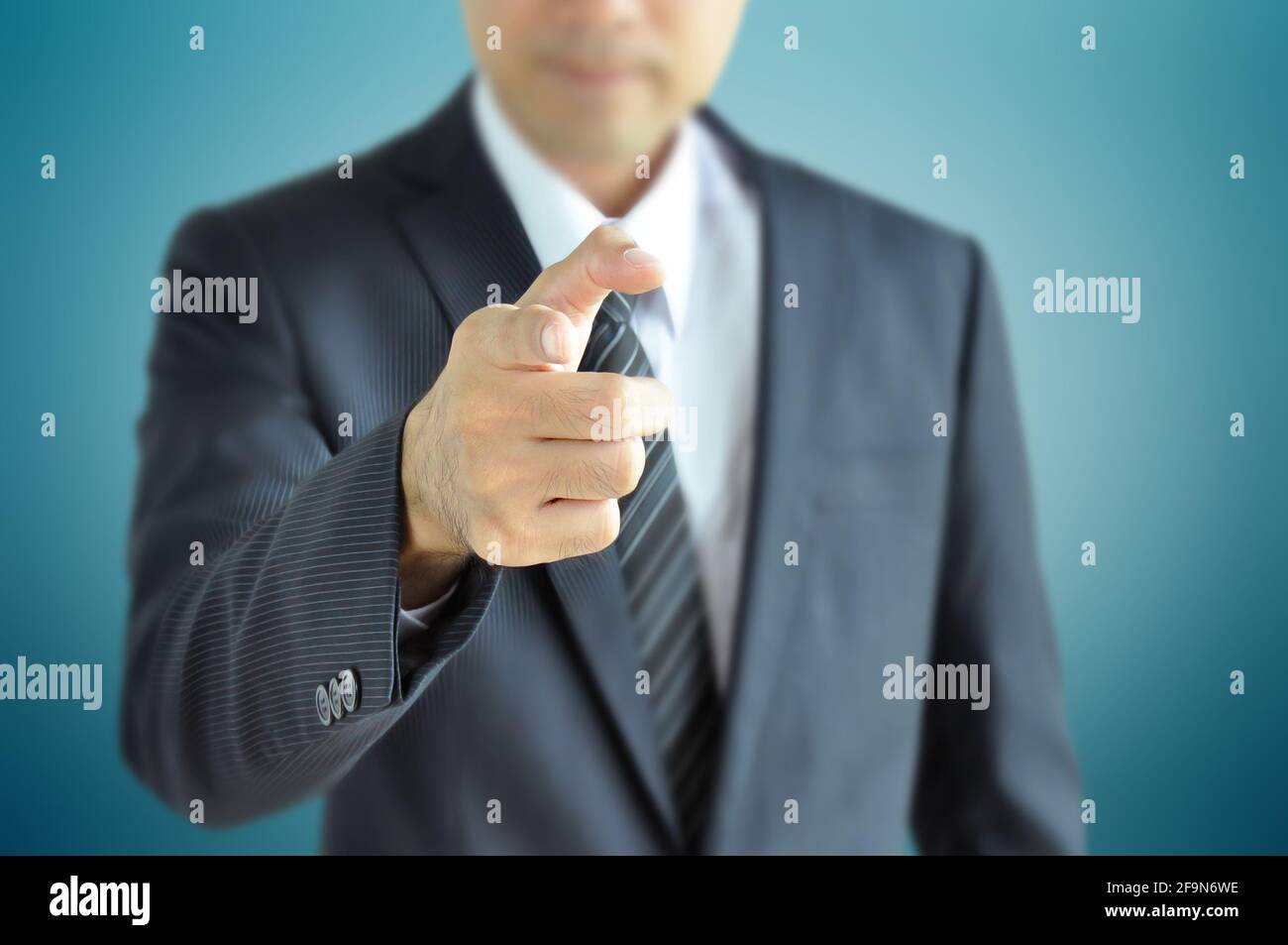 Businessman pointing finger at you Stock Photo - Alamy