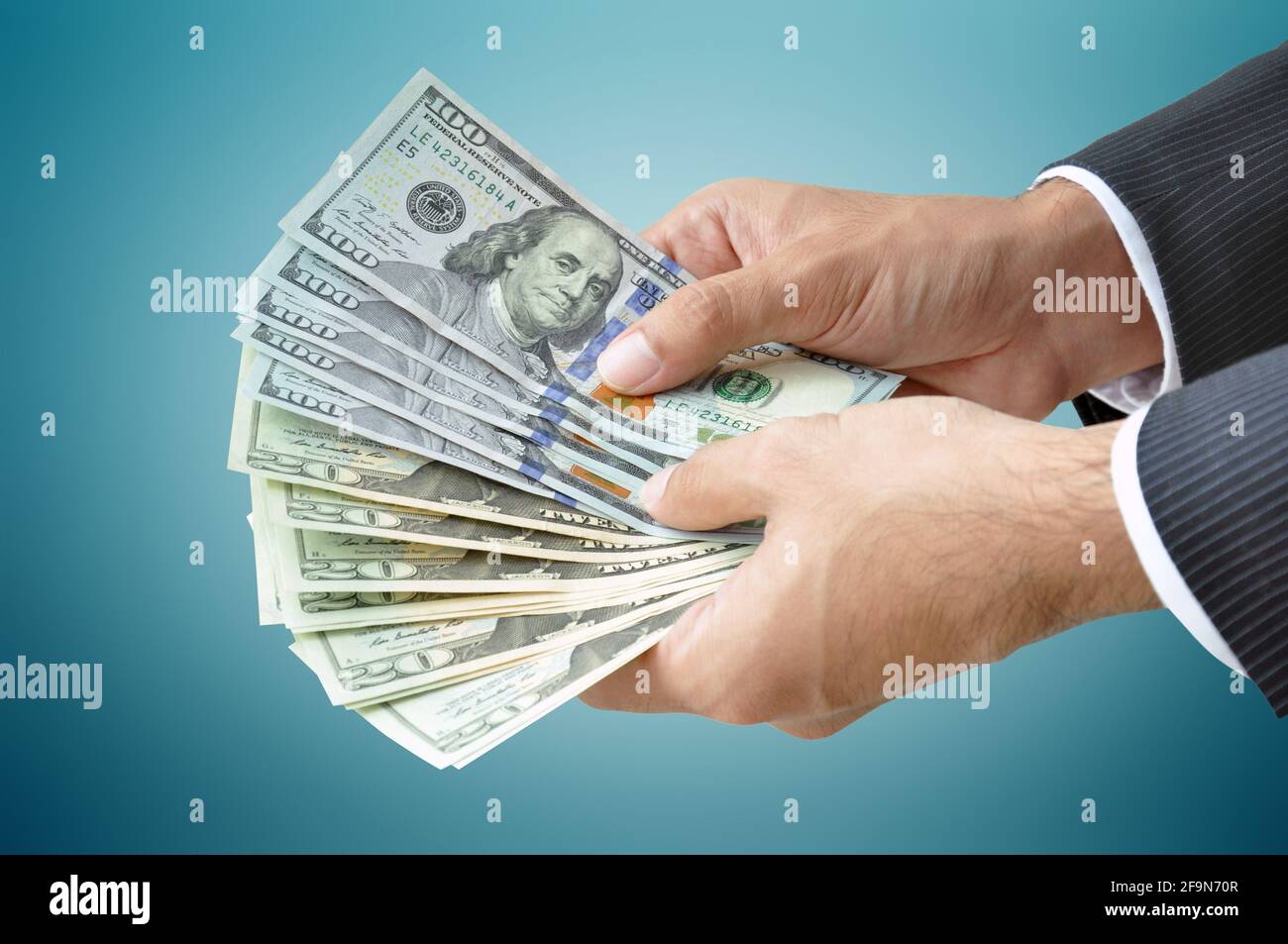 Hands counting money - United states dollar (USD) banknotes Stock Photo ...