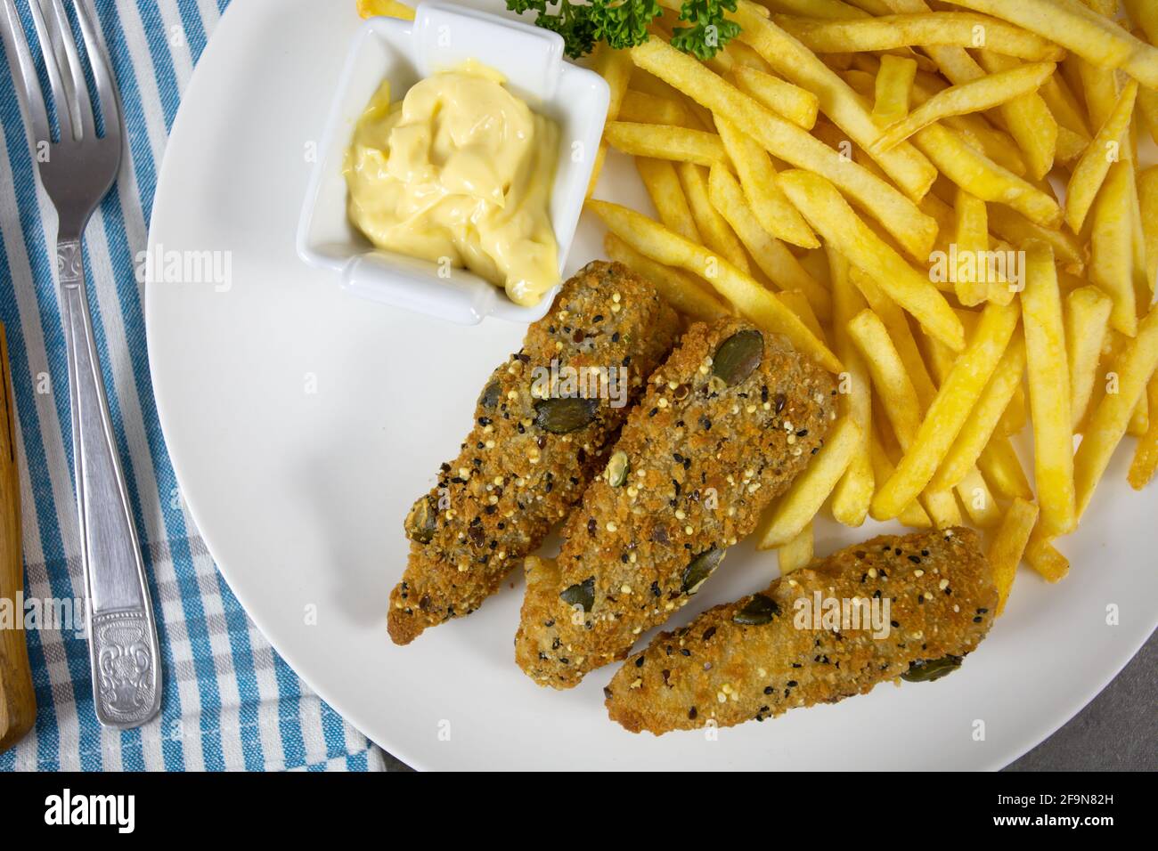 breaded fish with fries Stock Photo - Alamy