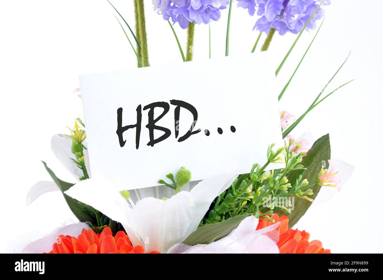 Happy birthday (or HBD) flower bouquet with tag card Stock Photo - Alamy