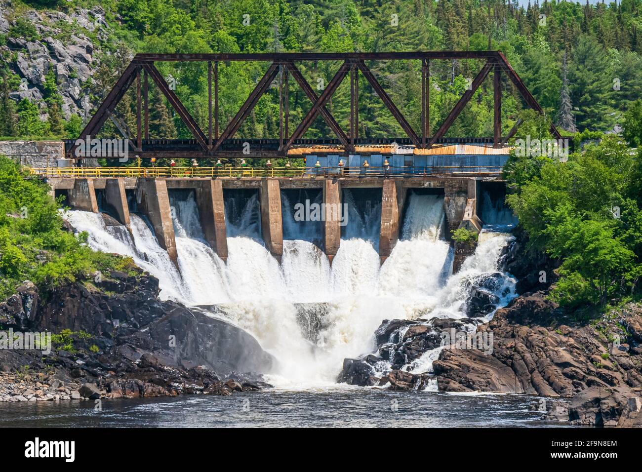 Cascades with Dam and railway bridge Ontario Canada in summer Stock ...