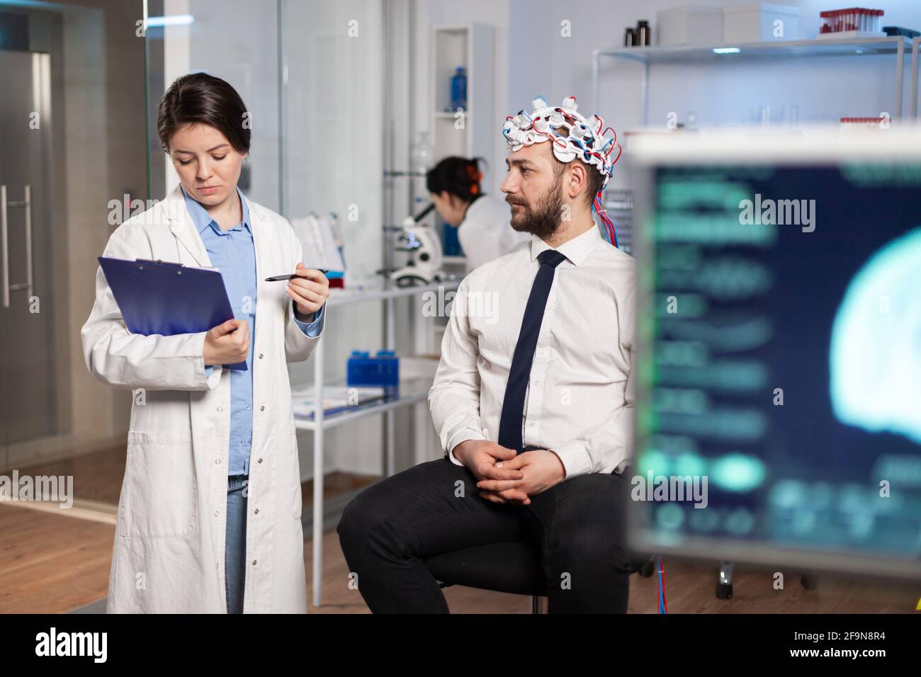 Medical doctor talking about symptoms of disease during investigations ...