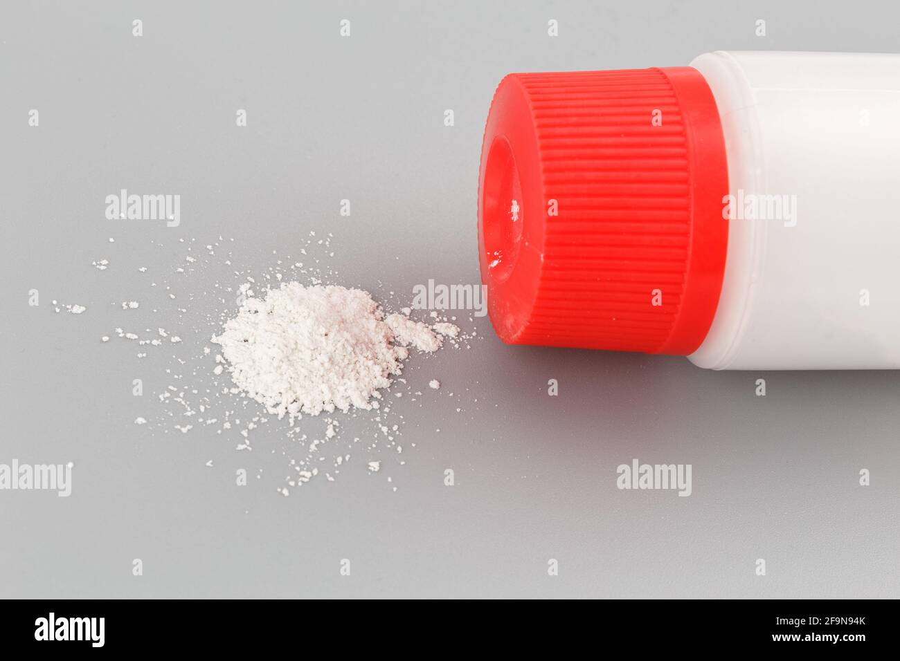 white plastic bottle of baby powder on gray background Stock Photo - Alamy