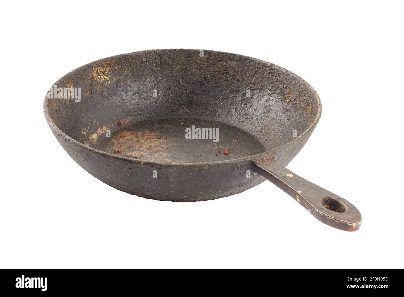 old disgusting stained rusty cast iron pan with burnt fat and food ...