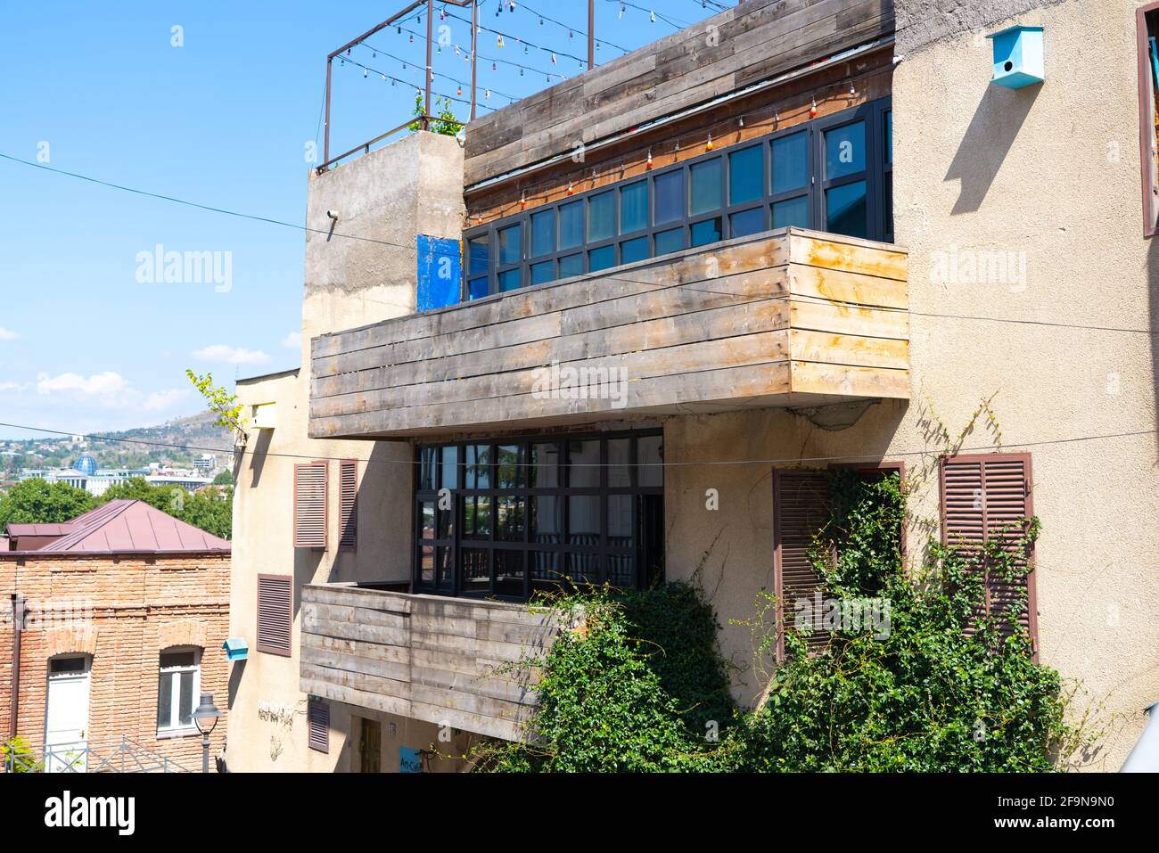 Wooden balcony blue glass windows Stock Photo - Alamy