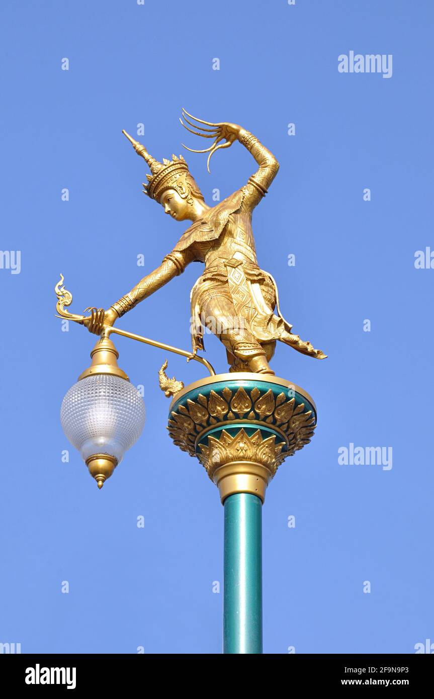 Ancient Thai style street lamp - golden woman statue as legendary ...