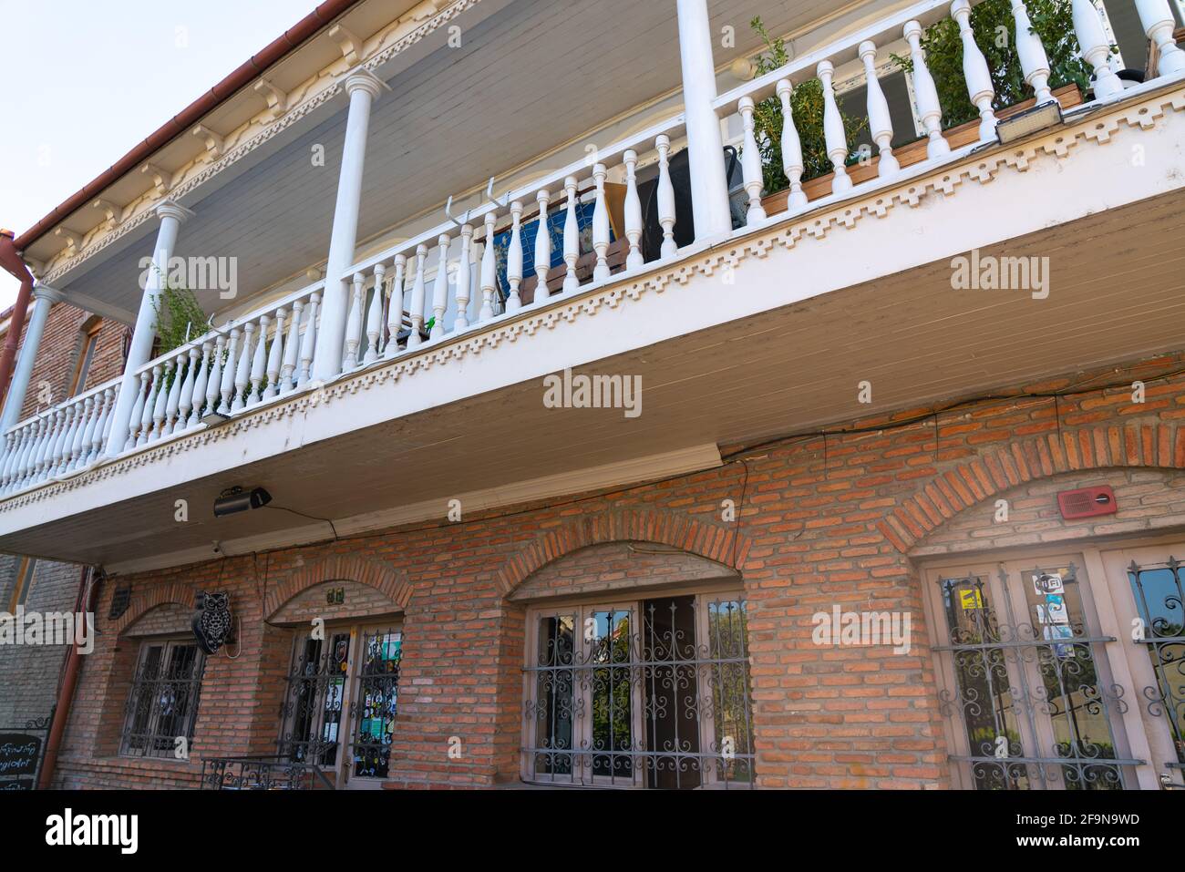 Wooden balcony with white balusters Stock Photo - Alamy
