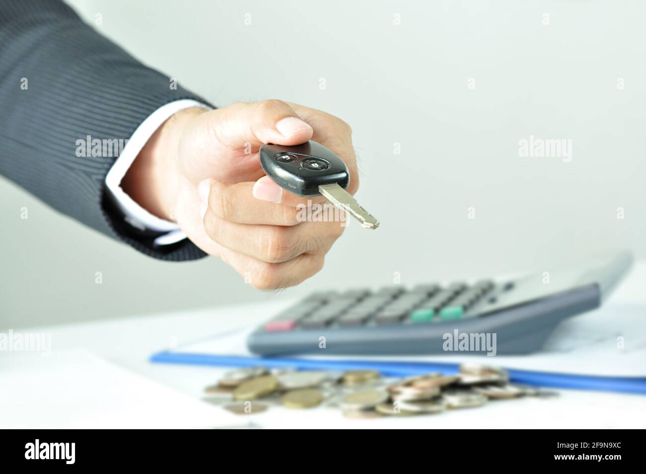 Businessman passing key hi-res stock photography and images - Alamy