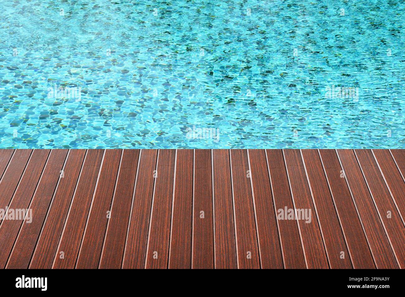 Brown wood plank over swimming pool water Stock Photo - Alamy