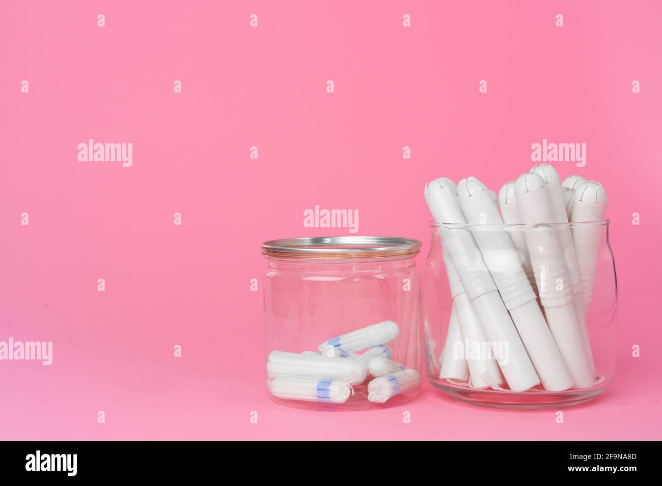 Female hygienic tampons on paper background close up Stock Photo - Alamy