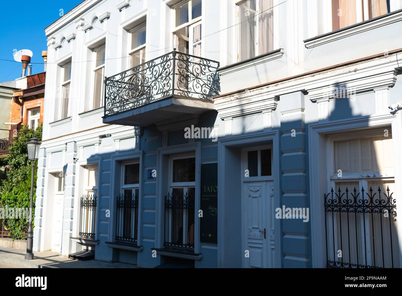 Metal patterned balcony street view Stock Photo - Alamy