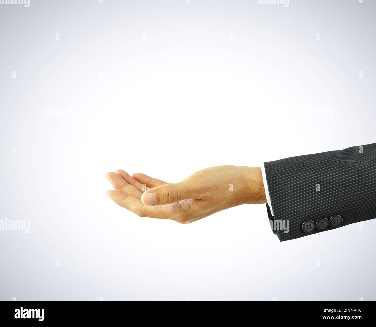 Empty open hand of businessman Stock Photo - Alamy