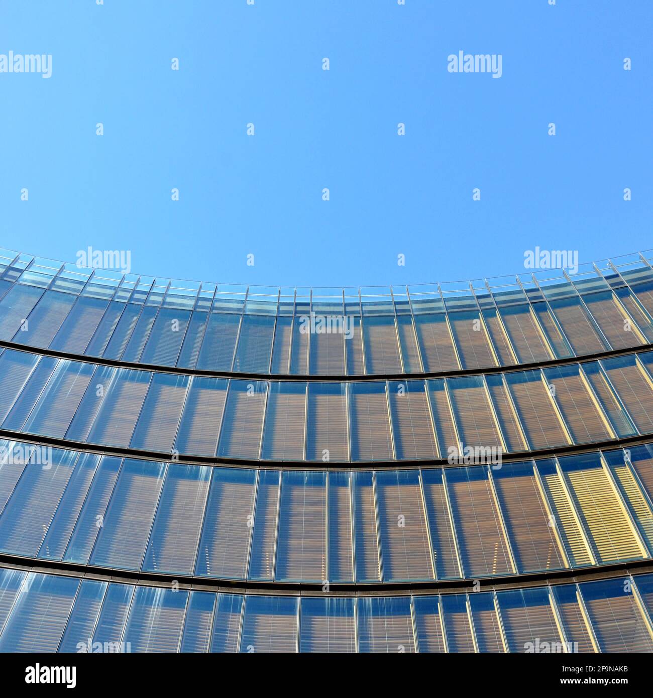 Curved building facade - looking up angle Stock Photo - Alamy