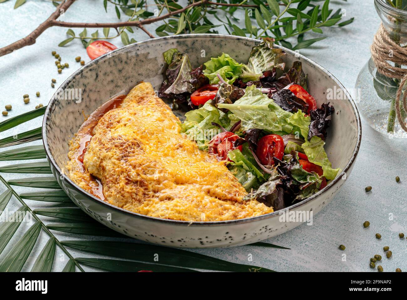 Rustic omelette with vegetables salad Stock Photo - Alamy