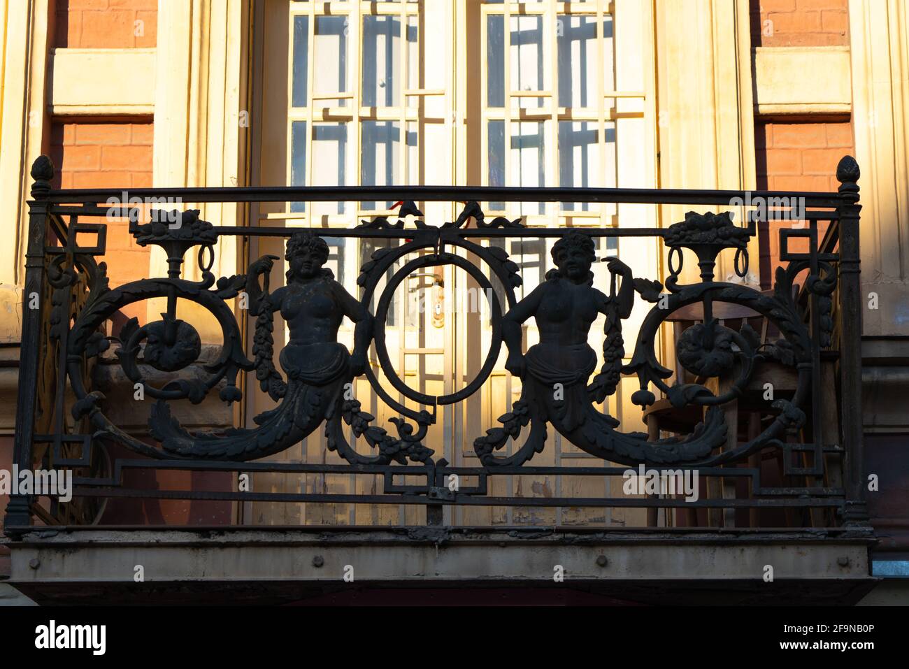 Metal patterned balcony street view Stock Photo - Alamy