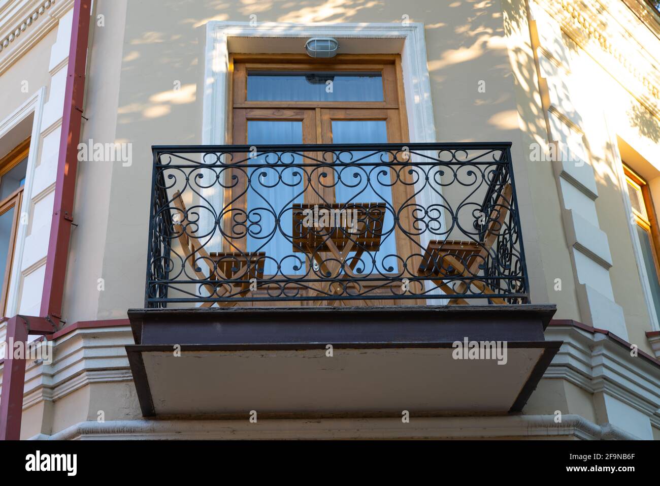 Metal patterned balcony street view Stock Photo - Alamy