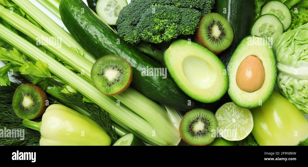 Fresh green vegetables on whole background, close up Stock Photo - Alamy