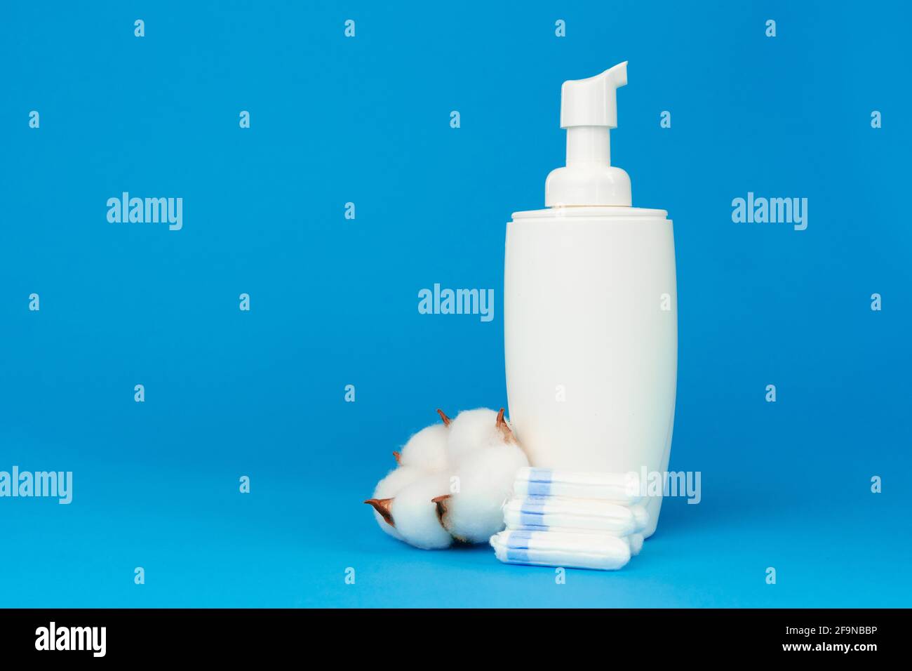Female medical tampons and shower gel bottle Stock Photo - Alamy