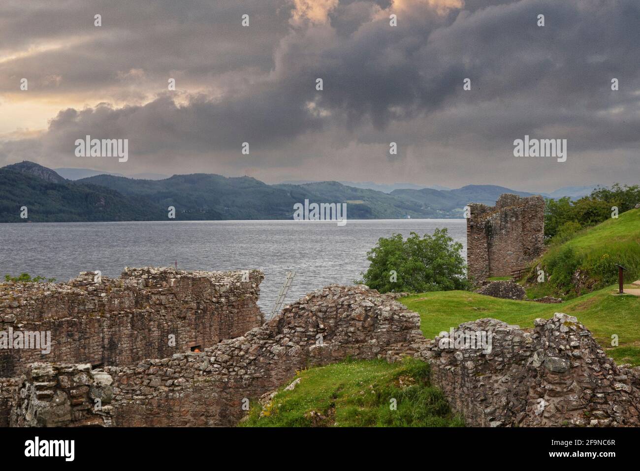 Ruins of ancient medieval Urquhart castle on the shore of Loch Ness in ...