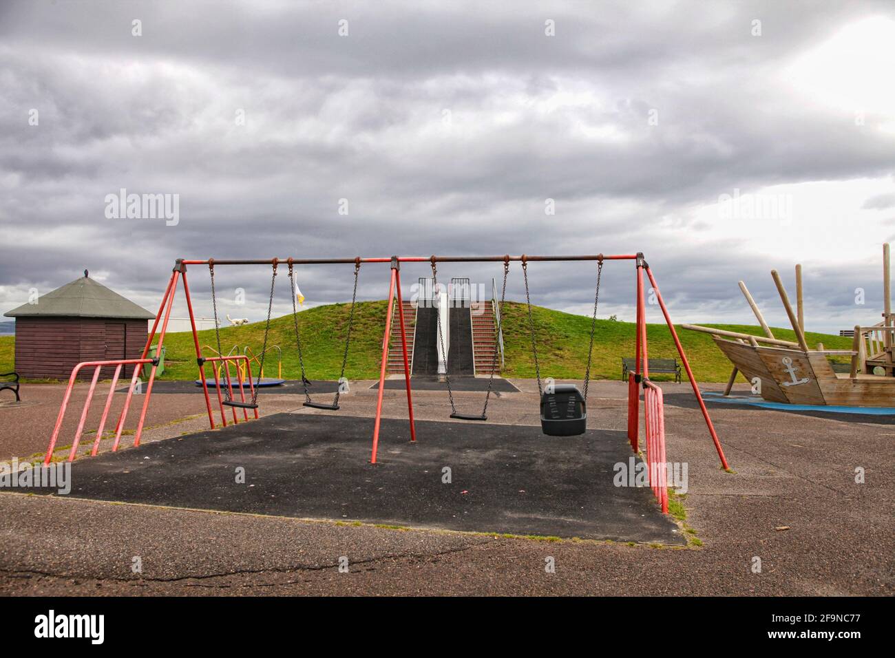 Empty playground with swing on the waterfront in Scotland Stock Photo ...