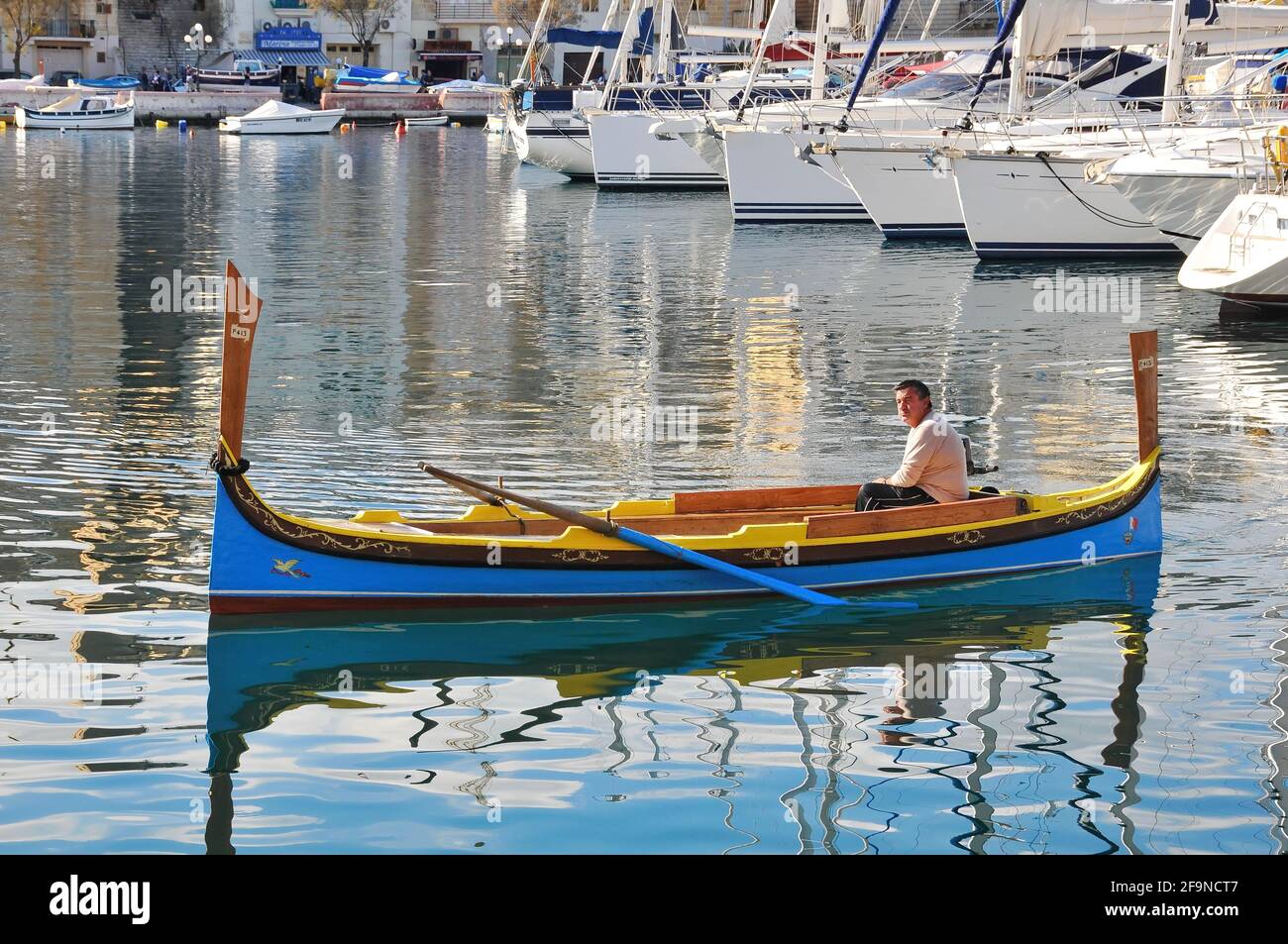 Traditional Maltese colorful fishing boat in the port Valletta Malta ...