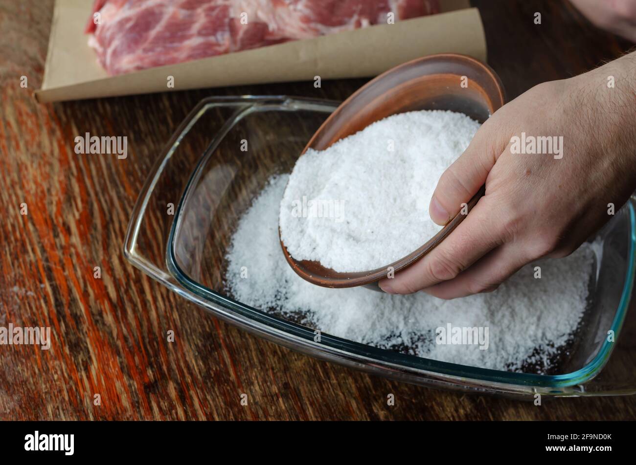 To sprinkle meat with salt hi-res stock photography and images - Alamy