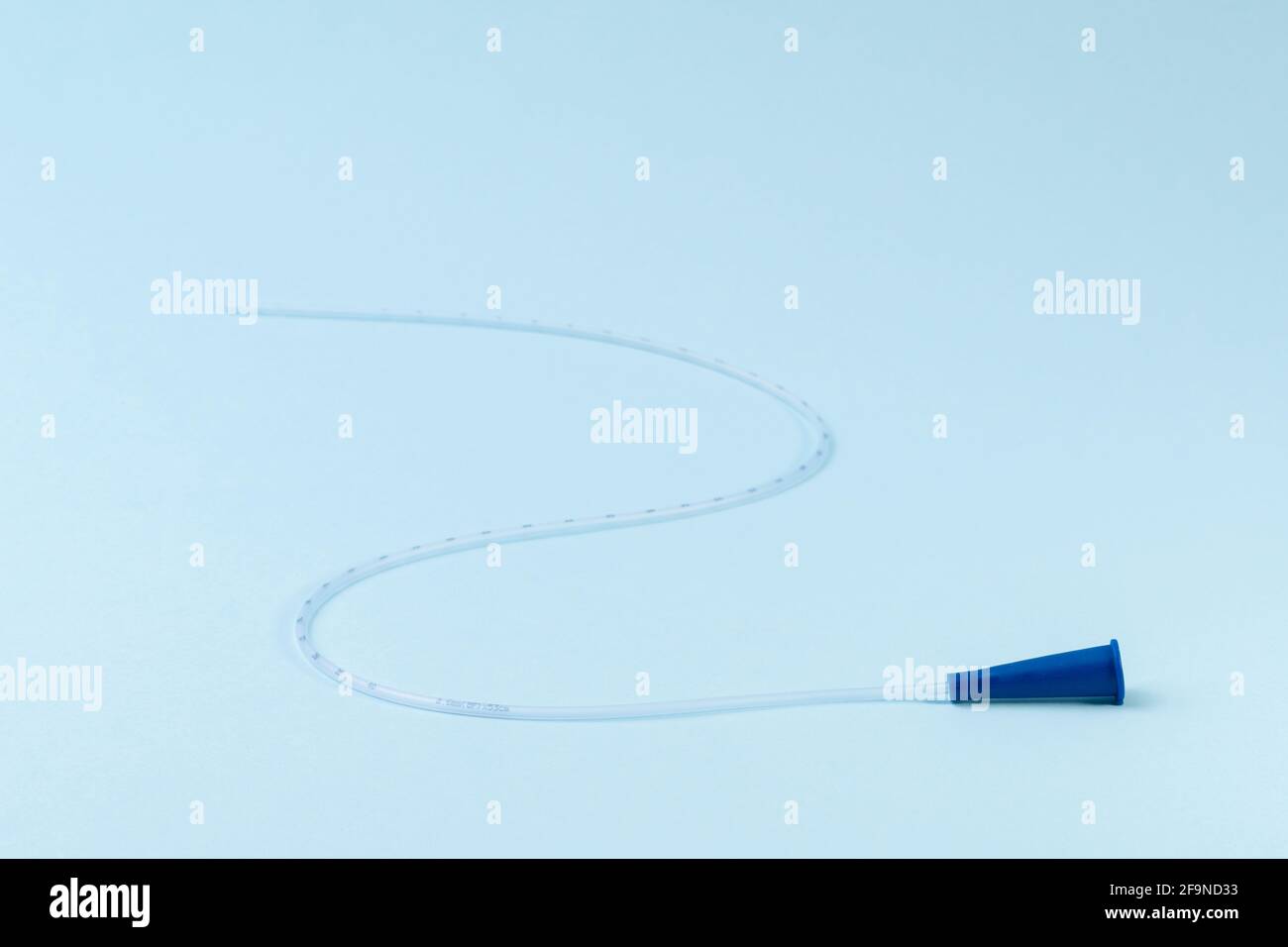 Rusch male and female all purpose catheter on blue background, straight ...