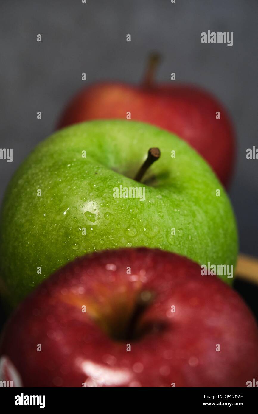 green and red apple in a row vertically on Stock Photo - Alamy