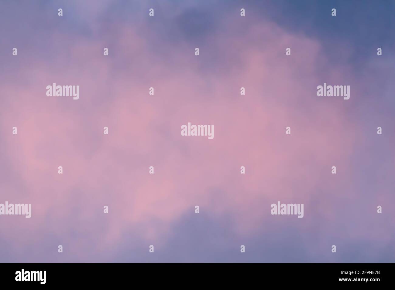 pink, lilac, purple clouds in blue sky at dawn or early morning ...