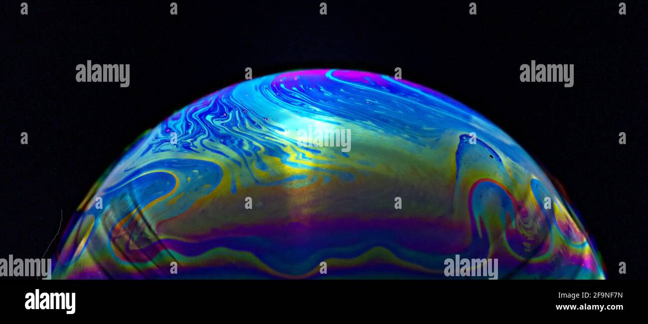 A colorful soap bubble in a macro photography perspective in the ...