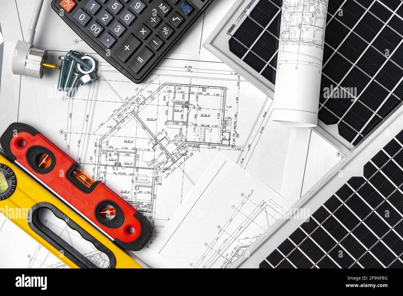 Architectural blueprints and solar panel on table Stock Photo - Alamy