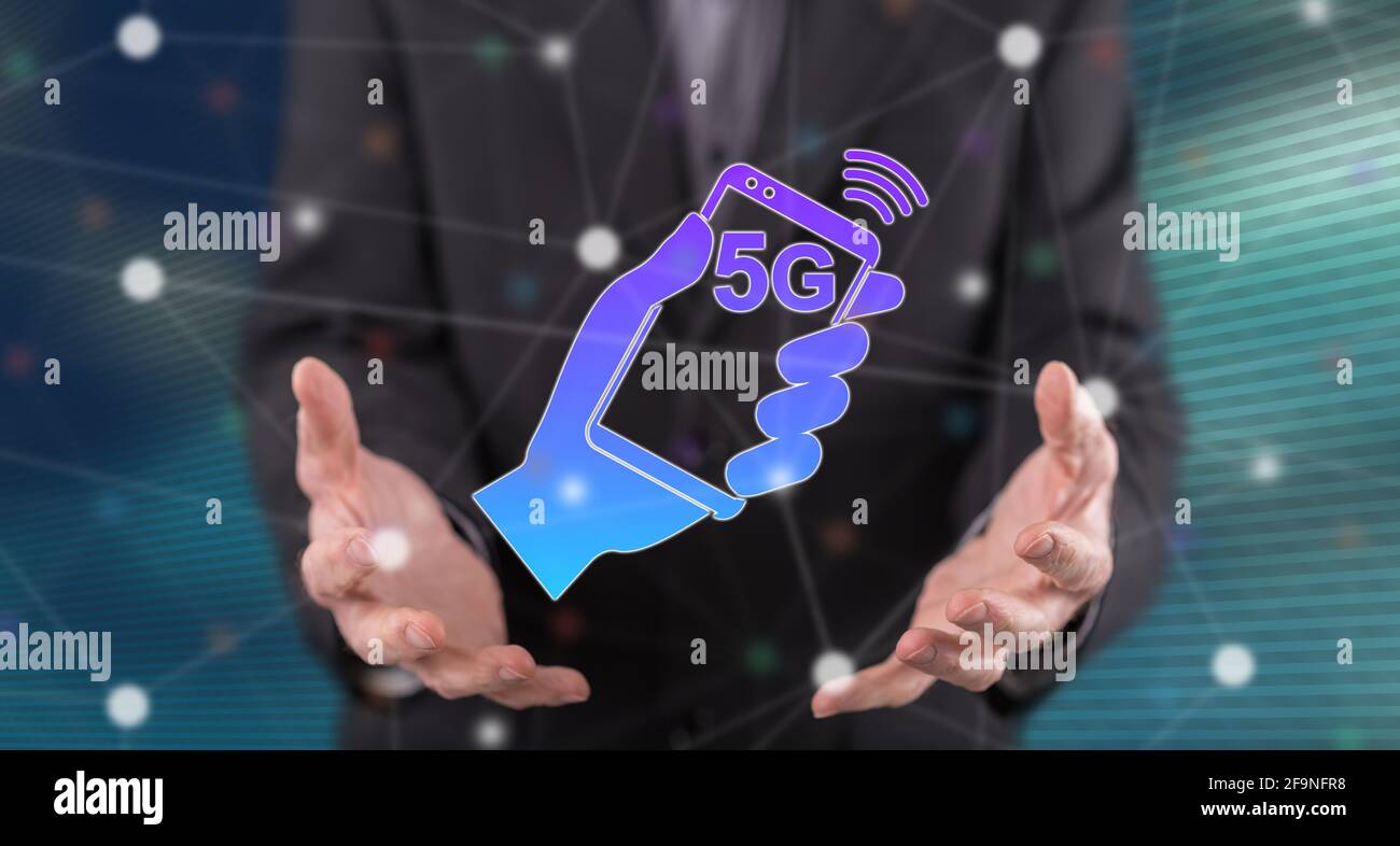 5g concept above the hands of a man in background Stock Photo - Alamy