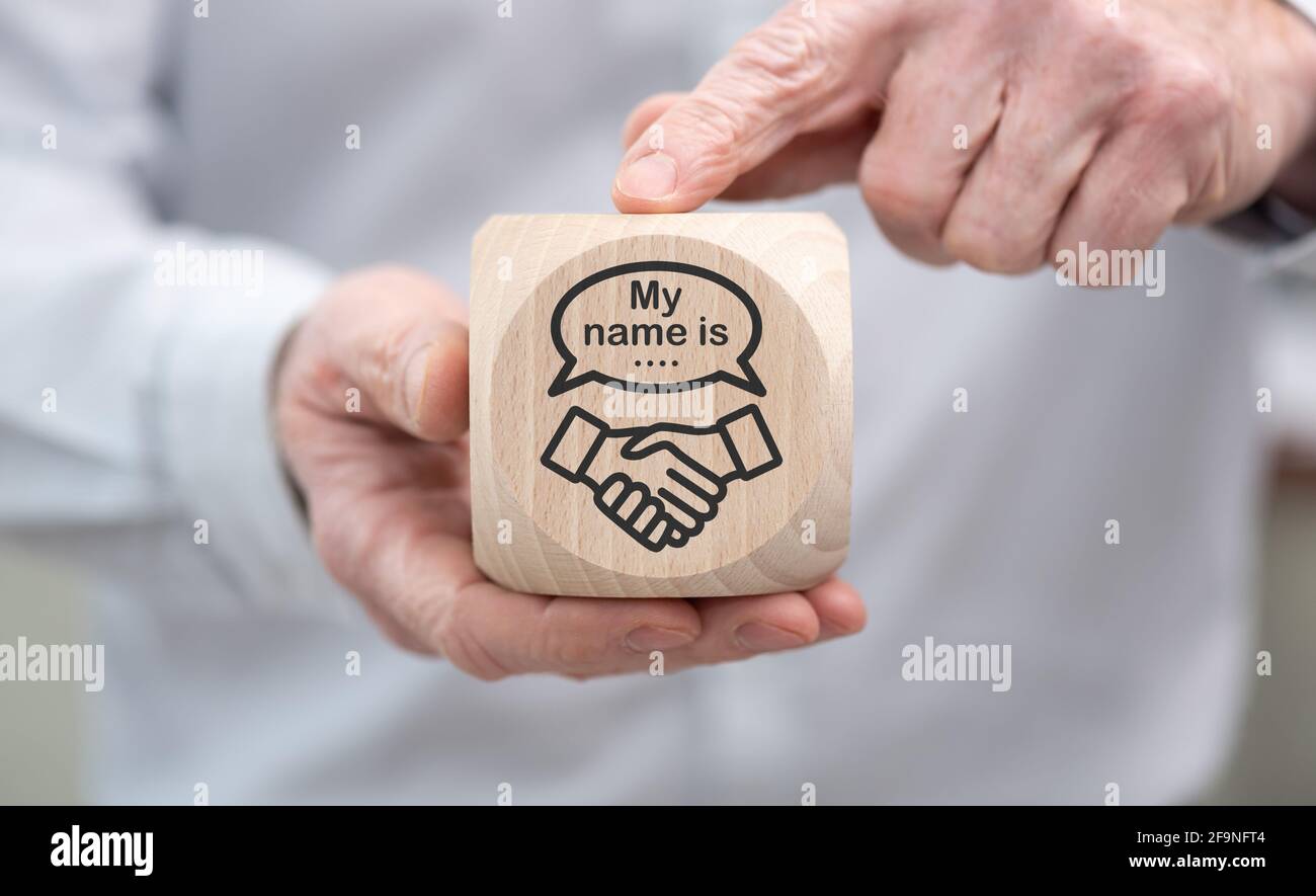 Hand holding a wooden cube with symbol of introduction concept Stock ...