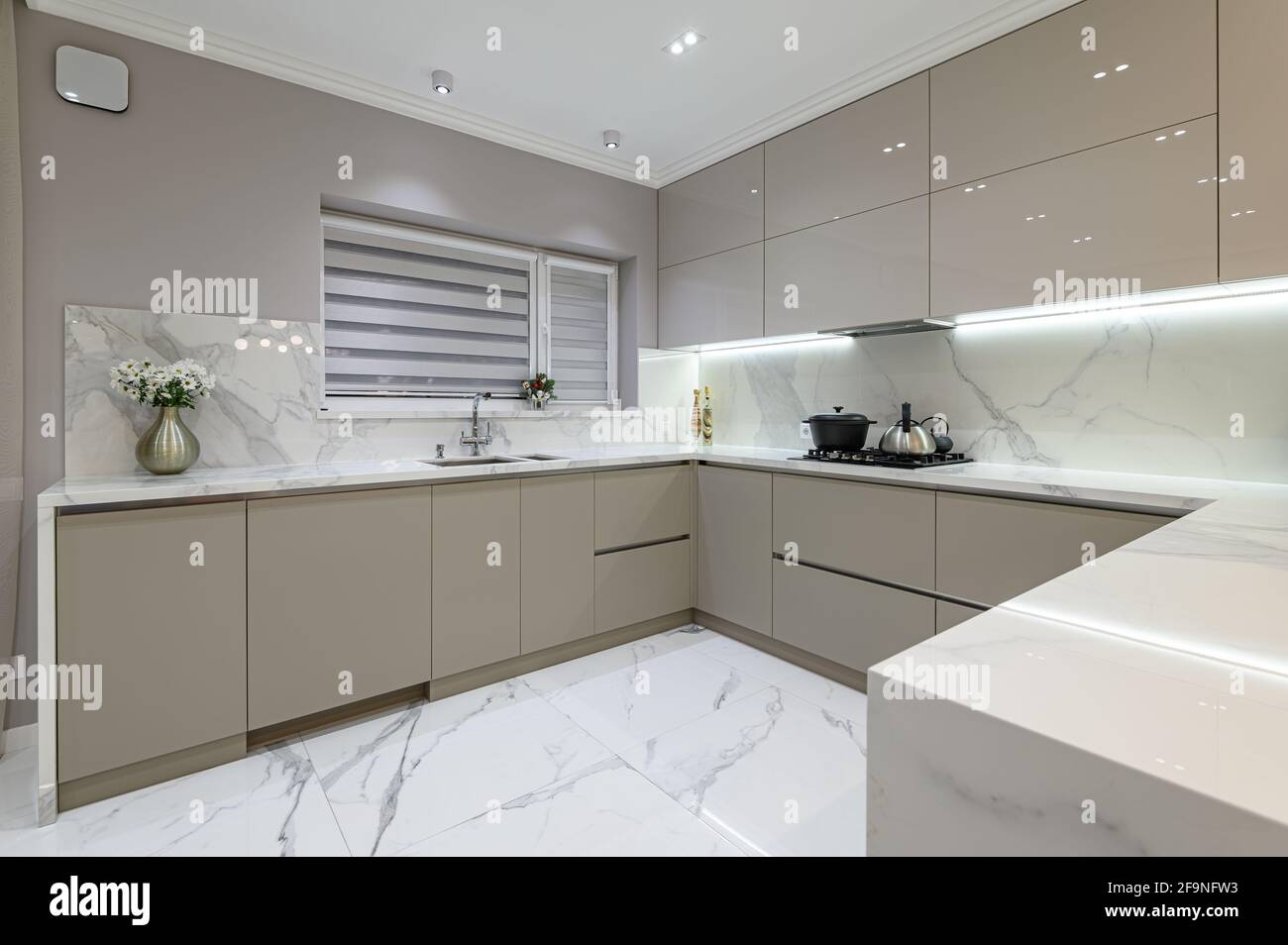 Luxury white modern marble kitchen in studio space Stock Photo - Alamy
