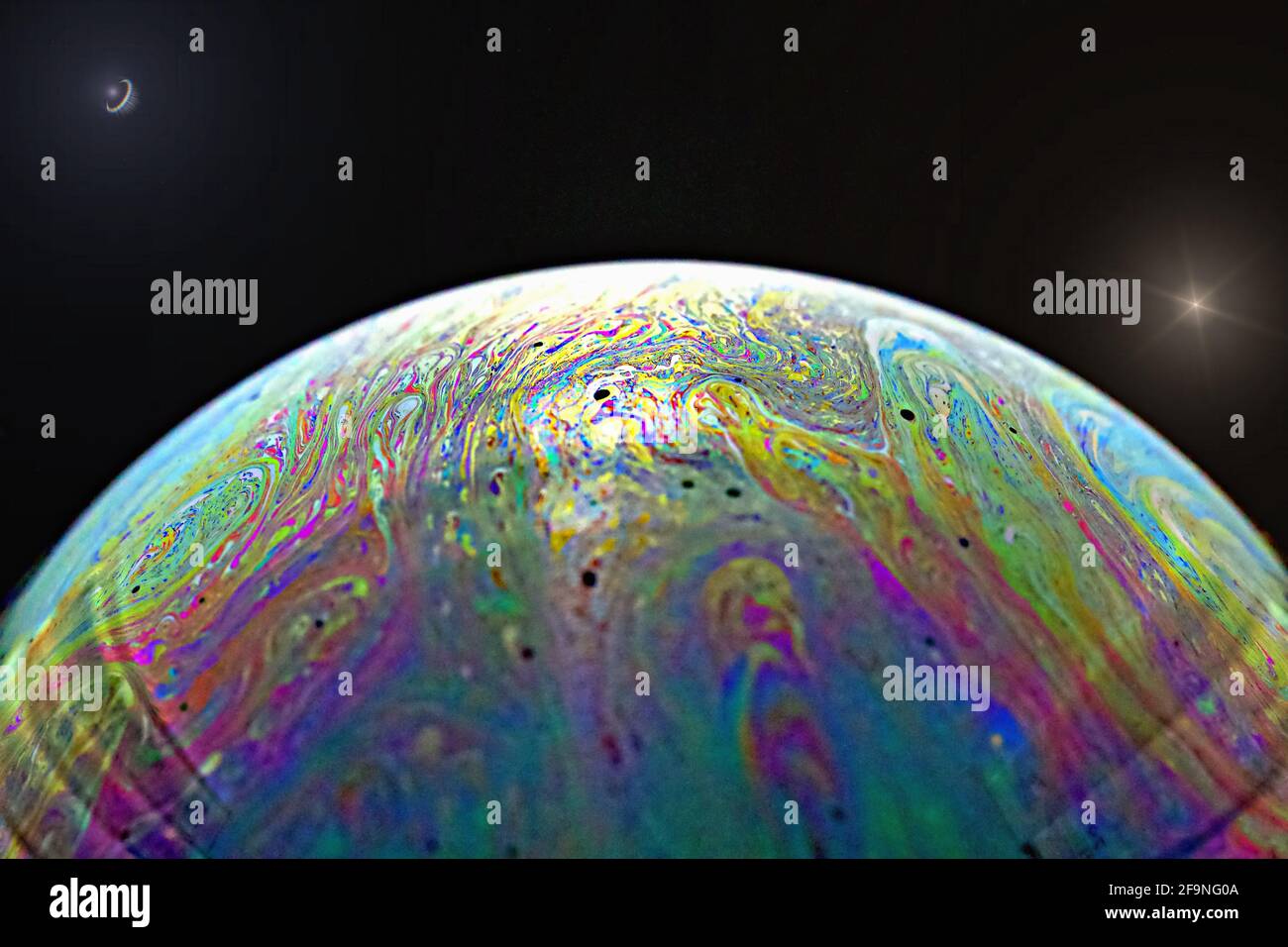 A colorful soap bubble in a macro photography perspective in the ...