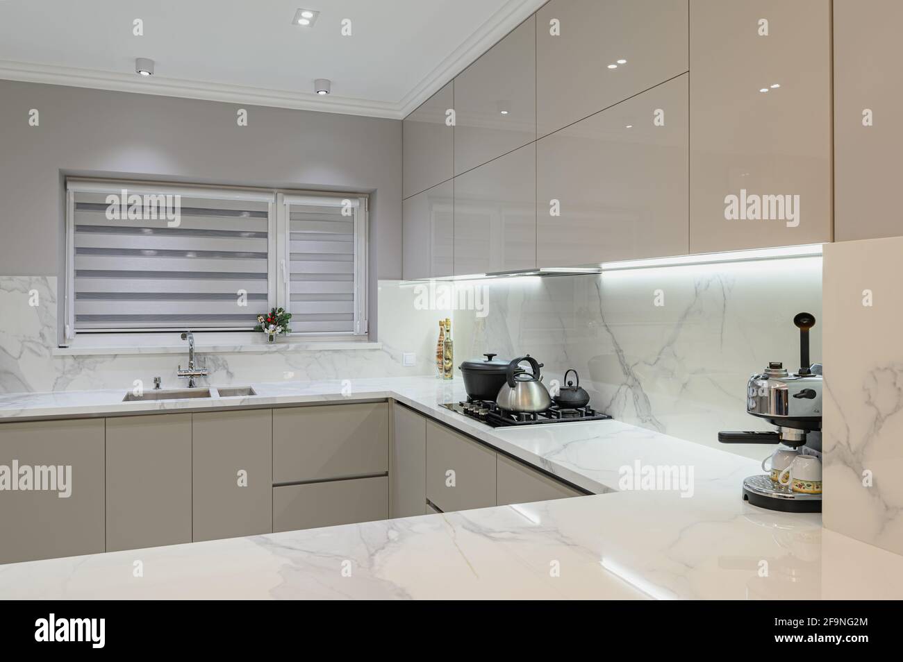 Luxury white modern marble kitchen in studio space Stock Photo - Alamy